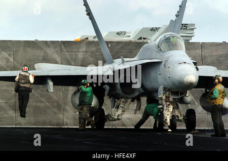 US Navy A final checker jumps skyward to inspect the aileron of an F-A ...