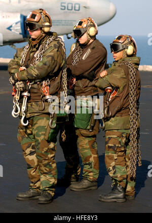 Plane Captains of Strike Fighter Squadron 105 clean an F/A-18C Hornet ...