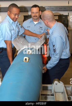 Aviation Ordnanceman 2nd Class (AO2) Robert McGill, left, AO2 John ...