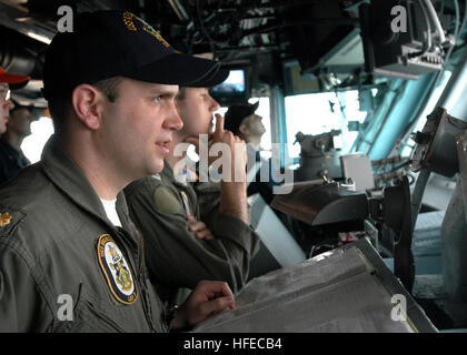 US Navy Bridge watchstanders work together to hold a steady course ...