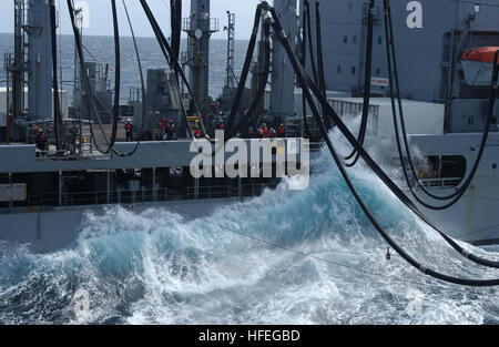 US Navy Waves reach the main decks of the fleet oiler USNS Rappahannock ...