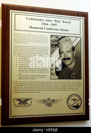US Navy A plaque presented in honor of Commander John Roach , hangs in ...