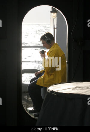 Seaman standing aft lookout watch aboard USS Carney (DDG-64) in the ...