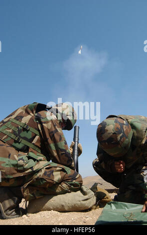 A Naval Special Warfare Group One Reserve Detachment fires an M-60 ...