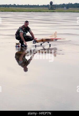 Photographer's Mate 2nd Class Milton Savage, USNR-R, joins a boarding ...