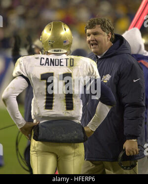 US Navy Navy head coach talks to the offensive line during the 104th ...