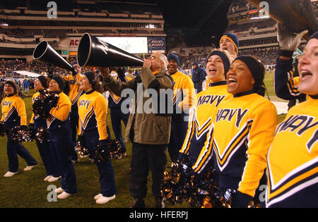 Secretary of the Navy, Naval Academy cheerleaders, and mascot conduct a ...