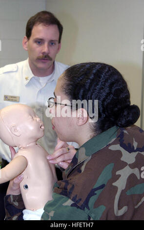 US Navy Under the watchful eye of Boatswain's Mate Seaman tightens the ...