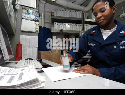 US Navy Airman and Storekeeper 1st Class assigned to USS Carl Vinson's ...