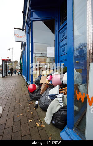 Pile of old clothes dumped in a container Stock Photo - Alamy