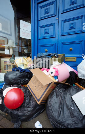 Pile of old clothes dumped in a container Stock Photo - Alamy