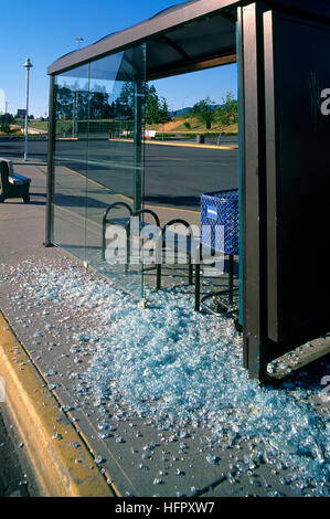 bus shelter vandalized vandalised with broken smashed glass window ...
