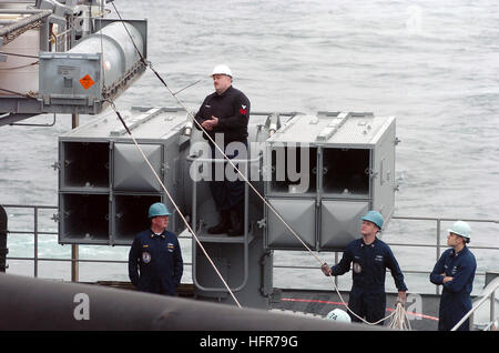 US Navy A Sailor stabilizes a RIM-7 NATO Sea Sparrow missile container ...