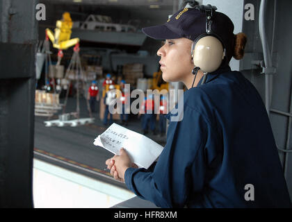 US Navy Engineman Fireman relays messages between the 1st lieutenant ...