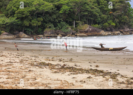 An indigenous woman fishing on a dugout canoe in várzea forest ...