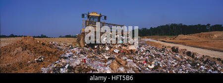 Heavy equipment at work in a sanitary landfill operation Stock Photo ...