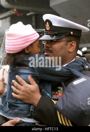 A Sailor reunites with his family during a homecoming at Naval Station ...