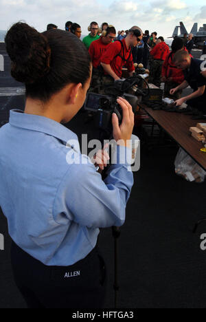 Sailors from the USS Nimitz Weapons Department raise ordnance on the ...