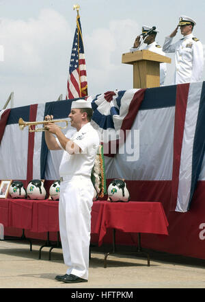 A U.S. Navy bugler, assigned to Navy Region Hawaii, plays taps while ...
