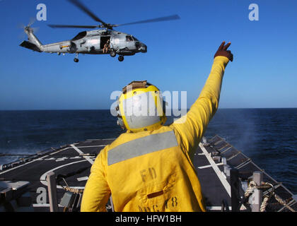 Boatswain's Mate directs SH-60 Seahawk helicopter from HSL-37 during ...