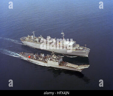 The destroyer tender USS ACADIA (AD-42) lies at anchor with a platform ...
