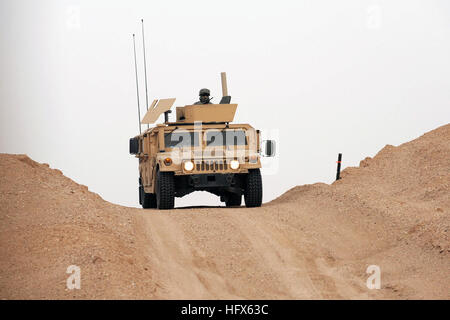US Navy Sailors check the top of a hill during convey training at Udari ...
