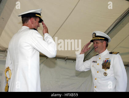 US Navy Capt. receives the relieving salute from the new Commanding ...