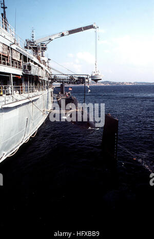 The Fulton-class submarine tender USS ORION (AS 18) services a ...