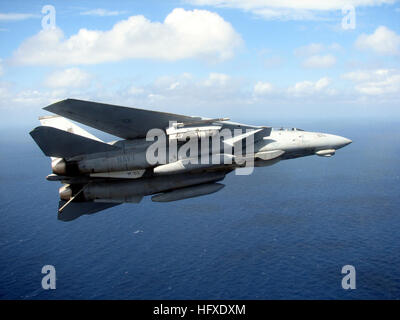 US Navy An F-14D Tomcat banks with its tailhook lowered in preparation ...