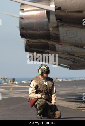 US Navy A Troubleshooter stands by to inspect his aircraft in ...