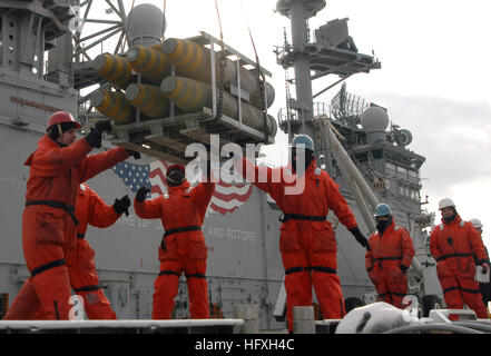 US Navy Aviation Ordnancemen carefully inventory ordnance aboard the ...