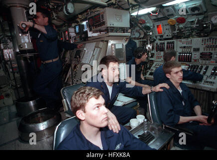 A chief petty officer talks to the helmsmen aboard the nuclear-powered ...