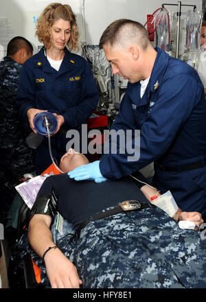 U.S. Navy Lt. Cmdr. Kimberly Syres, right, a surgeon aboard the ...