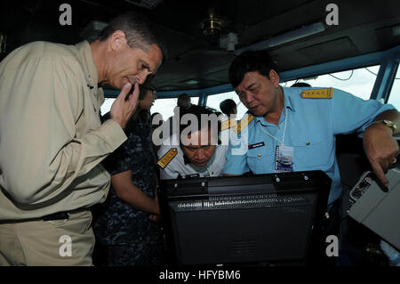 Capt. David Lausman, left, commanding officer of the aircraft carrier ...