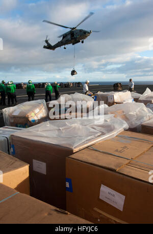 US Navy Helicopters deliver mail, food and other goods from the ...