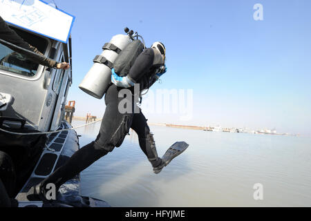 U.S. Navy diver enters the water for a mooring buoy inspection at ...