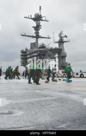 US Navy Sailors must wash down station aircraft to remove volcanic ash ...