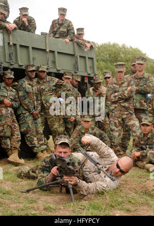 U.S. Marine Gunnery Sgt. Ryan Slusher watches his platoon work with the ...