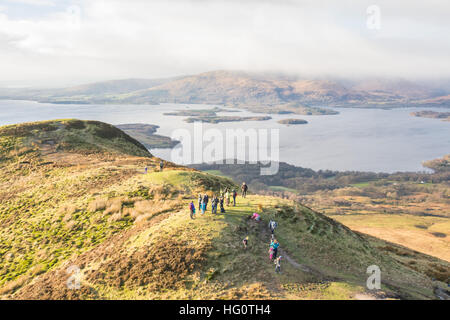 Walkers on Conic Hill summit above Balmaha, Loch Lomond Stock Photo - Alamy