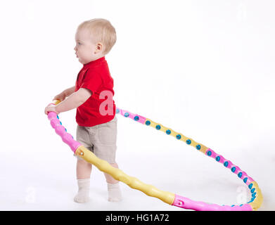 Child playing with hula hoop and training her skills Stock Photo - Alamy
