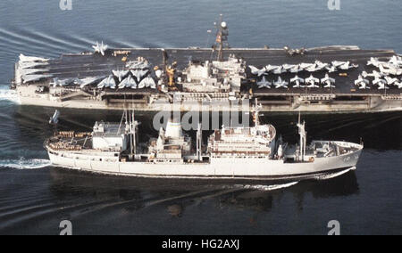USNS Saturn (T-AFS-10) replenishes USS America (CV-66) c1992 Stock ...