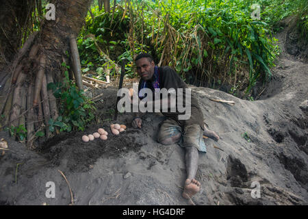 Megapode hunters hunting for eggs of the Megapode bird (Megapodiidae ...