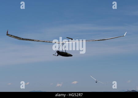 Two rigid wing hang gliders against blue sky Stock Photo - Alamy