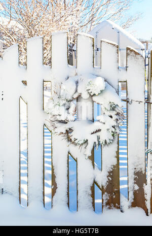 snow-covered Christmas wreath on a wooden background Stock Photo - Alamy