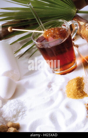 Black tea with candy sugar in a tea glass on a wooden table Stock Photo ...