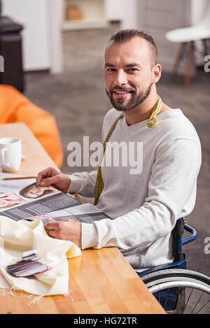 dressmaker reading a magazine Stock Photo - Alamy