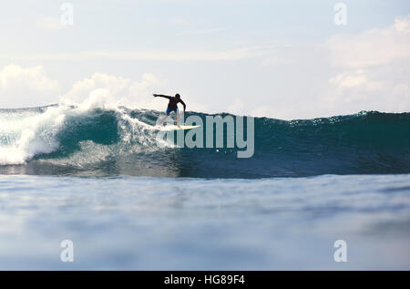Man surfboarding in sea against sky Stock Photo - Alamy