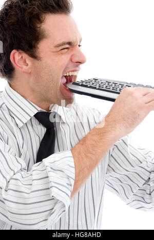 aggressive businessman biting in keyboard Stock Photo - Alamy