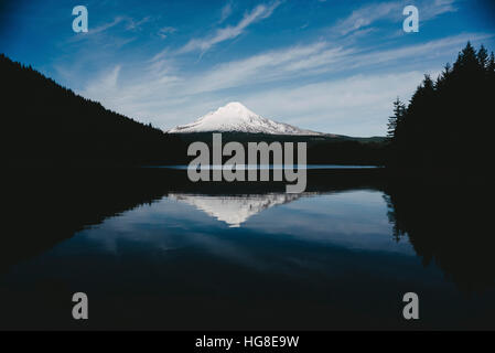 The calm Trillium lake view reflecting trees and clear sky background ...