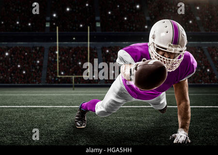 Football Player with a pink uniform scoring on a pink background Stock ...